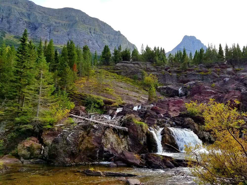 RedRock Falls Hike near Many Glacier Hotel - Fit Living Lifestyle