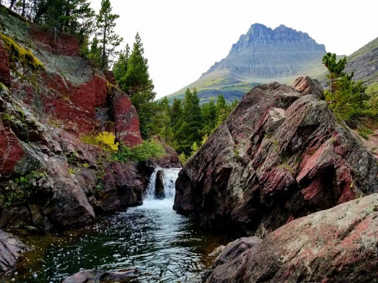 RedRock Falls Hike near Many Glacier Hotel - Fit Living Lifestyle