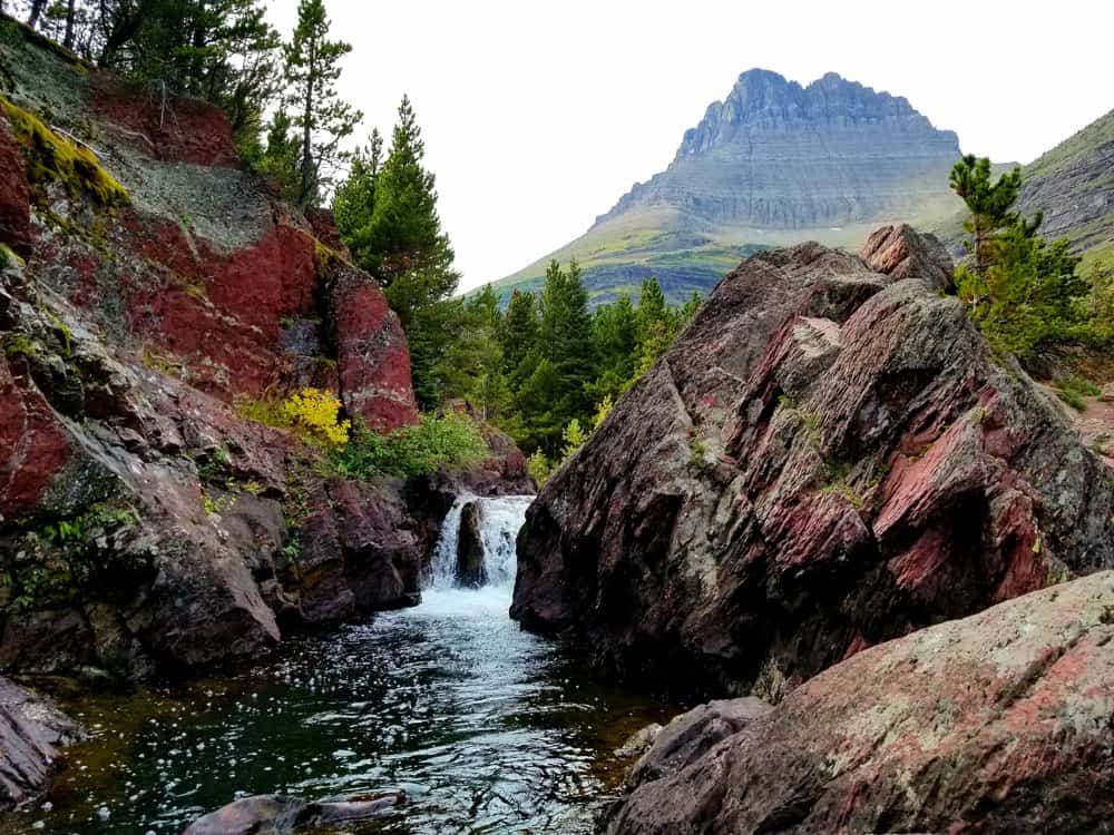RedRock Falls Hike near Many Glacier Hotel - Fit Living Lifestyle
